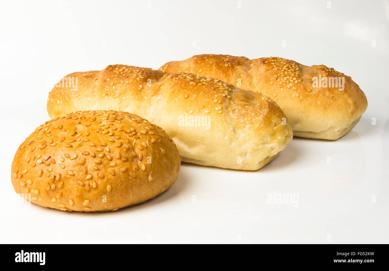 whole wheat two breads and bun on white background Stock Photo - Alamy