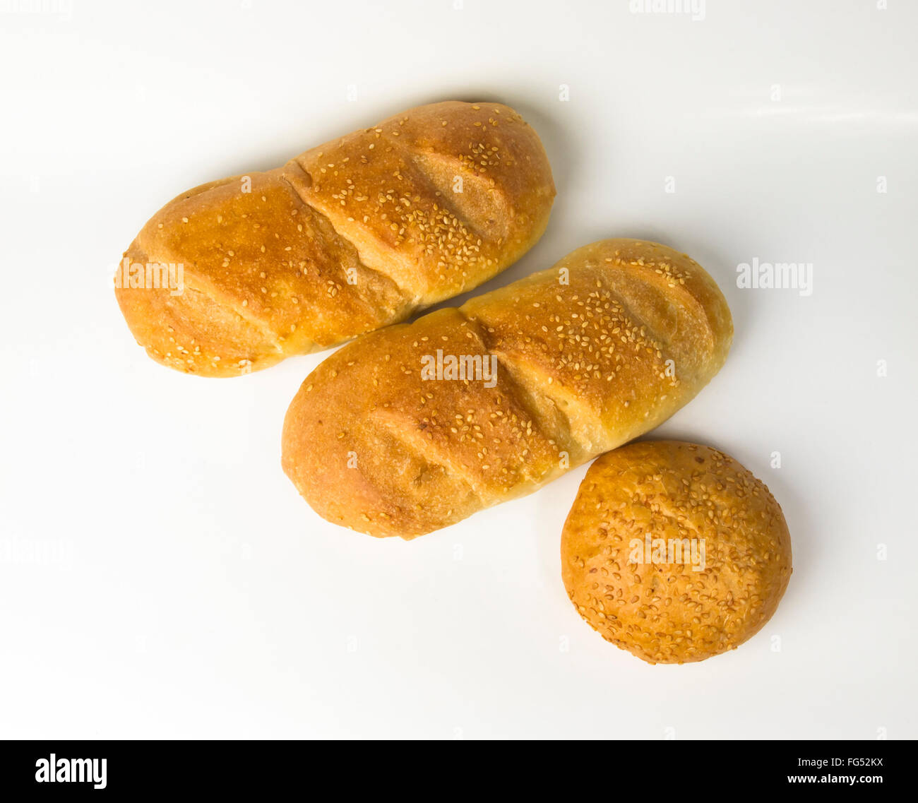 whole wheat two breads and bun on white background Stock Photo - Alamy