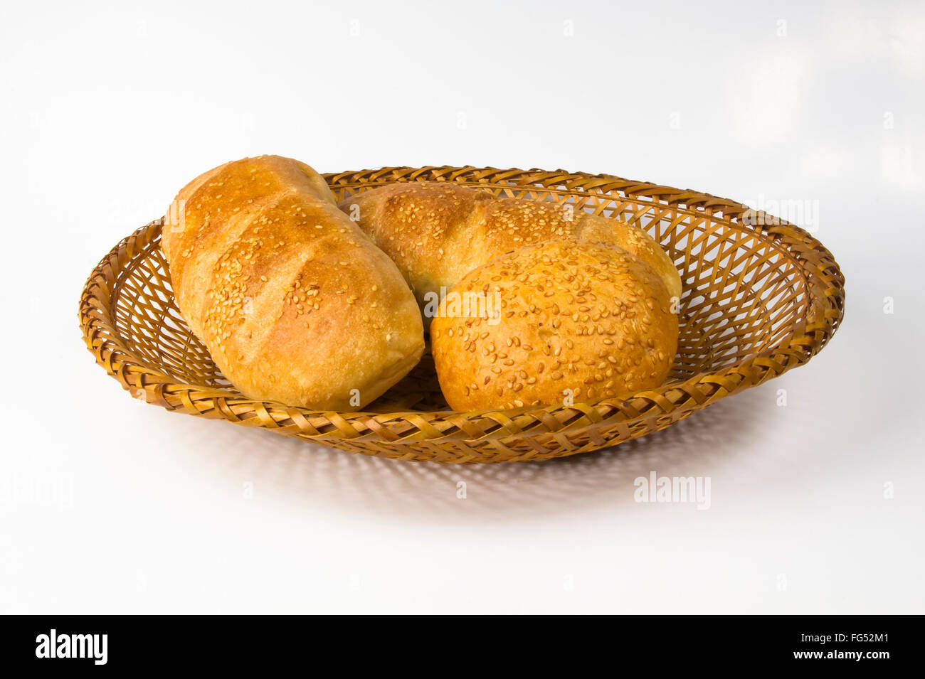 whole wheat two breads and bun on a wicker plate Stock Photo - Alamy