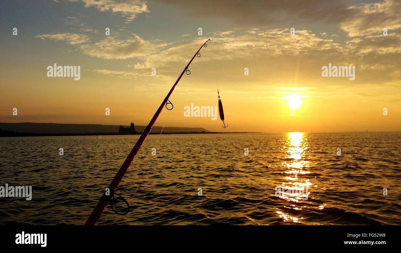 Fishing rod sunset hi-res stock photography and images - Alamy