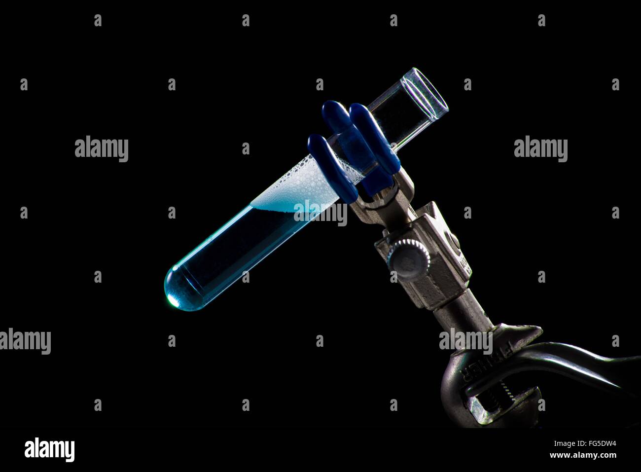 Solution in a test tube Stock Photo - Alamy
