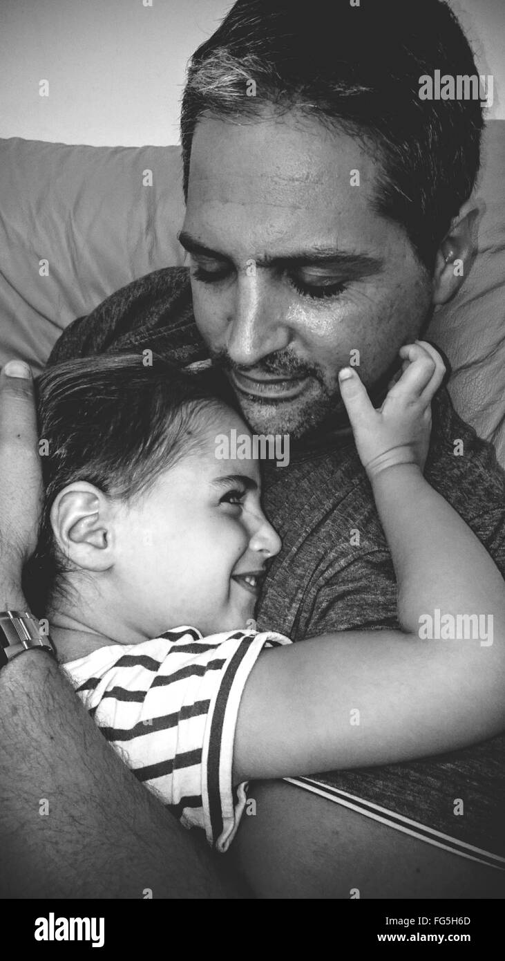 Cuddling on sofa hi-res stock photography and images - Alamy