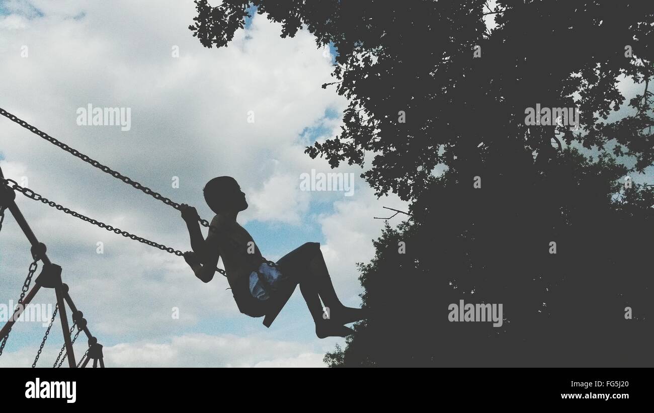 Boys playing swing hi-res stock photography and images - Alamy