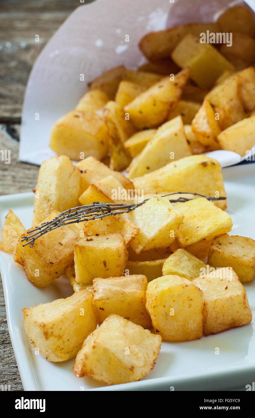 square deep fried potato on paper and tray Stock Photo - Alamy