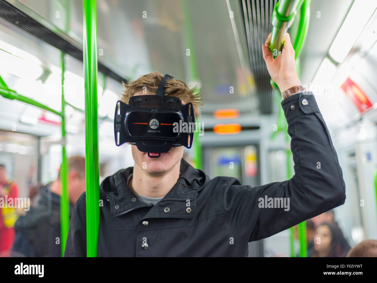 Young adult using a virtual reality in the train Stock Photo - Alamy