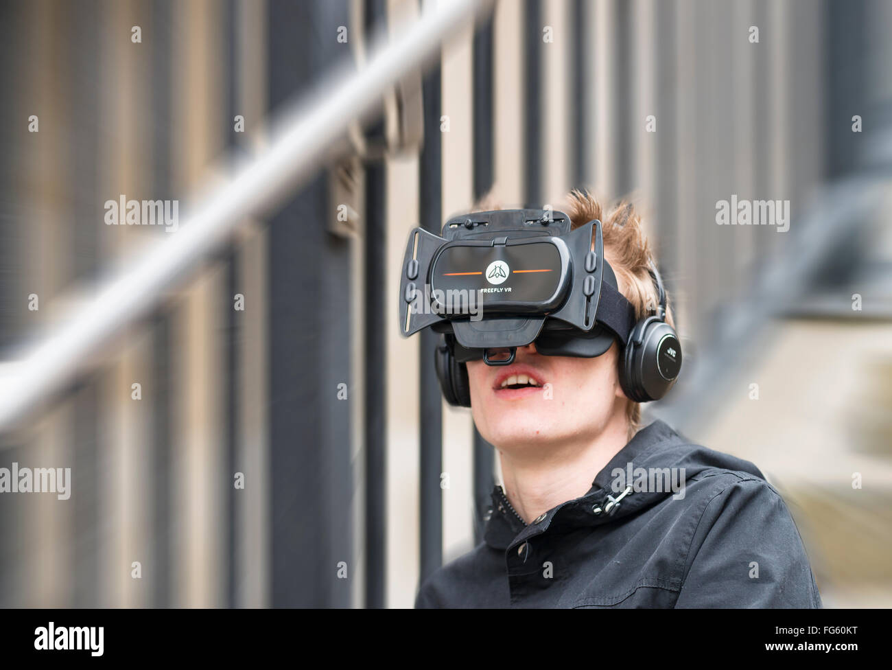 Young adult using a virtual reality at outdoor Stock Photo - Alamy