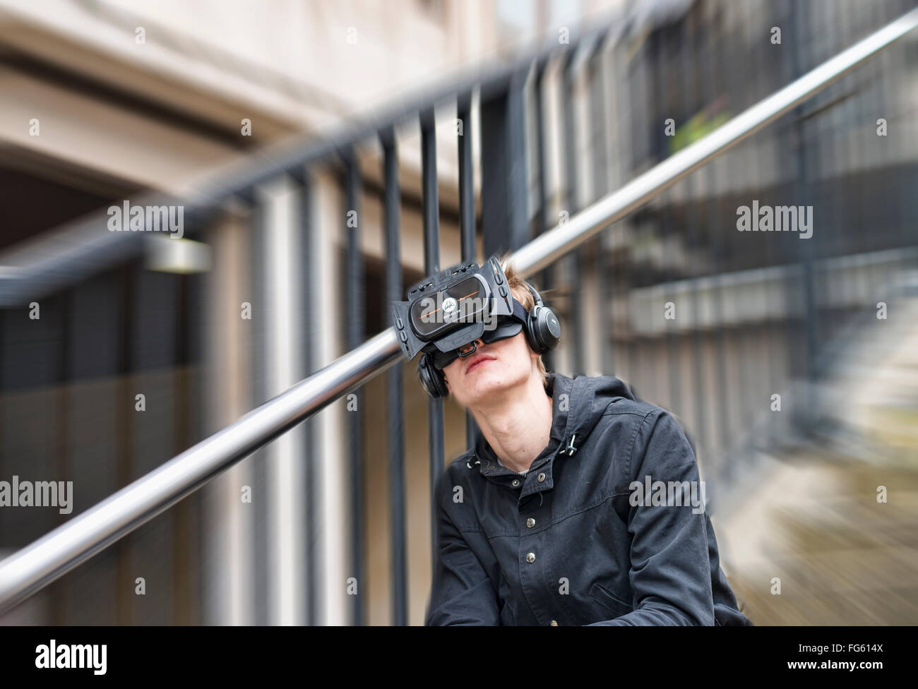 Young adult using a virtual reality at outdoor Stock Photo - Alamy