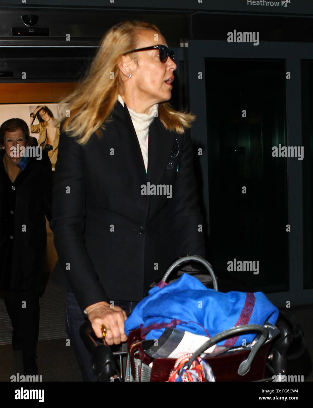 Jerry Hall, recently engaged to Rupert Murdoch, arrives at Heathrow ...