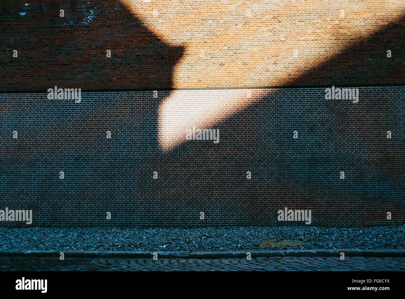 Brick Wall Building With Sunlight Stock Photo - Alamy