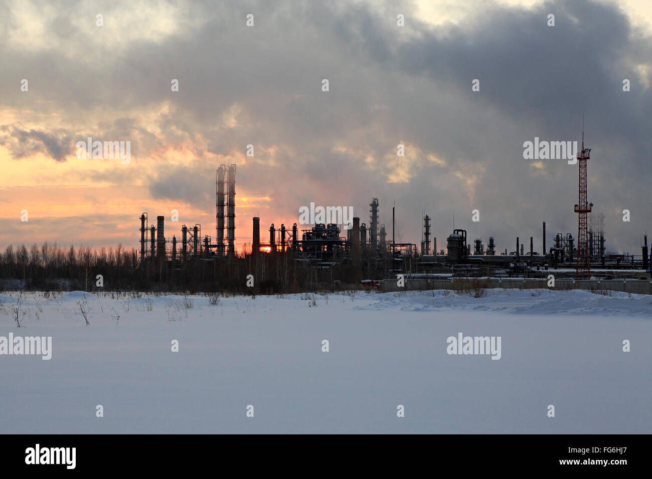 Refinery at sunset sky background. Frosty snowy winter evening Stock ...