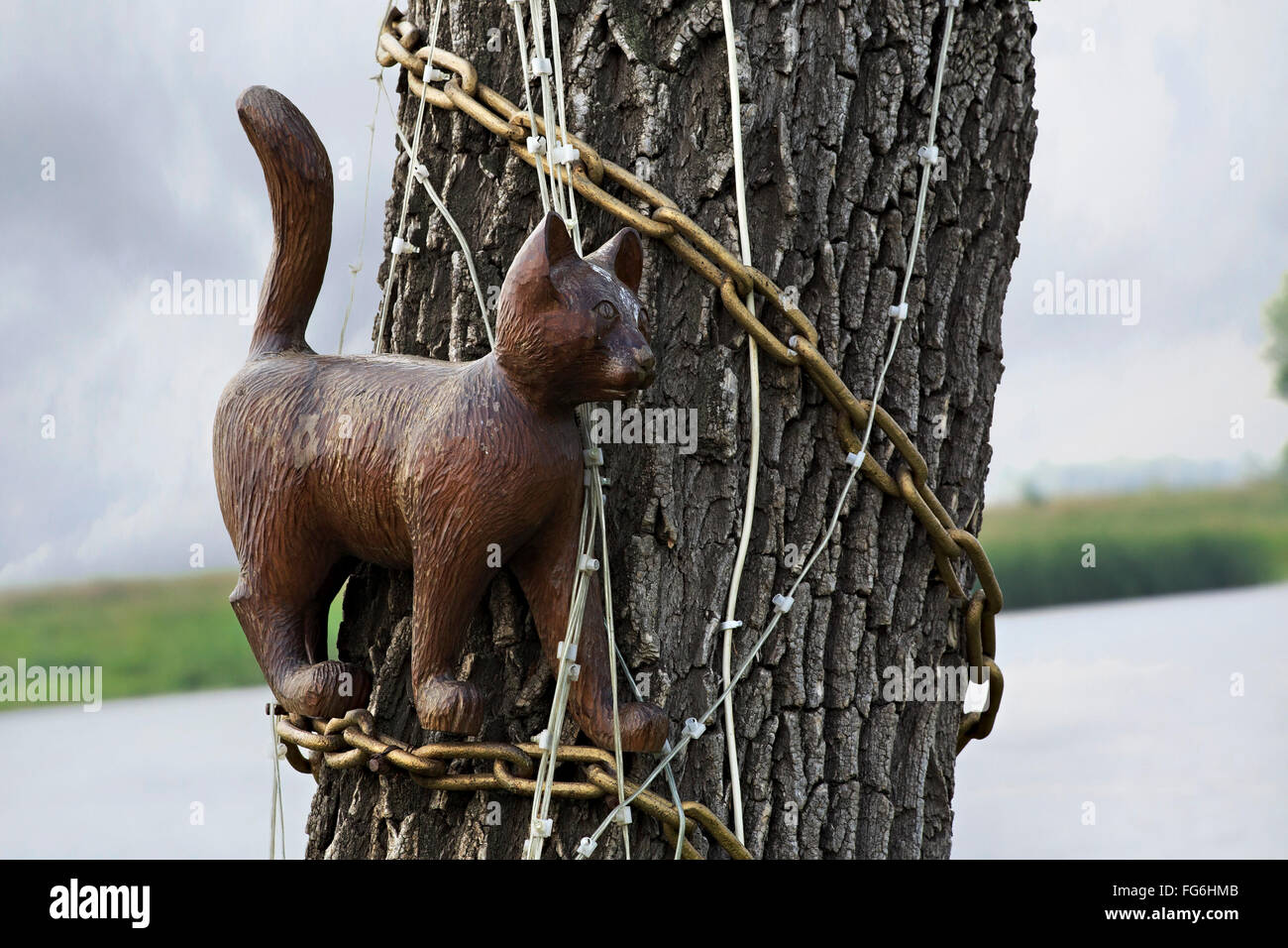 Cat walks on a chain around. Wooden sculptures based on Pushkin's fairy ...