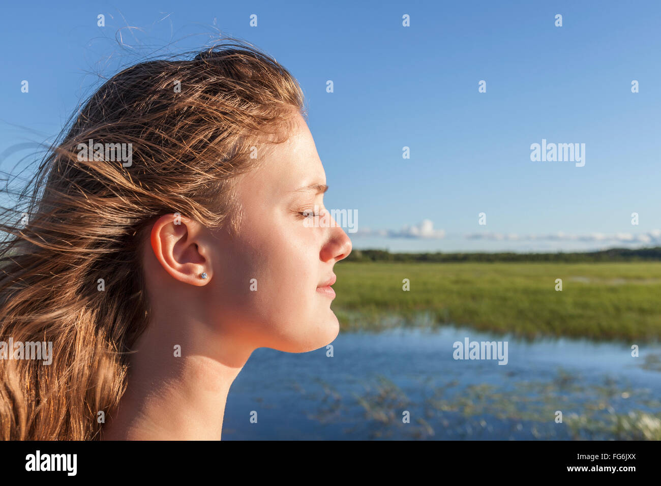 Girl facing wind at Balsam Lake; Ontario, Canada Stock Photo - Alamy