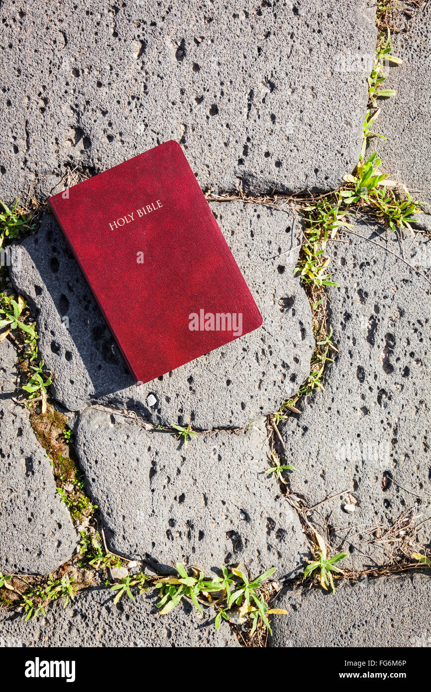Bible sitting on an old rock at an ancient ruins site; Tarsus, Turkey ...
