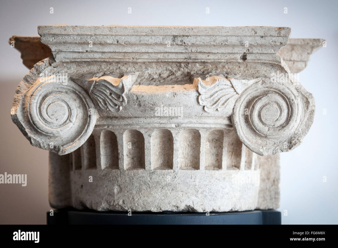 Close up of a stone pillar on display in an archaeological museum ...