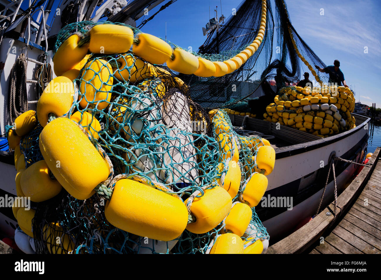 Crew members stack corks aboard commercial fishing seiner, Kodiak ...