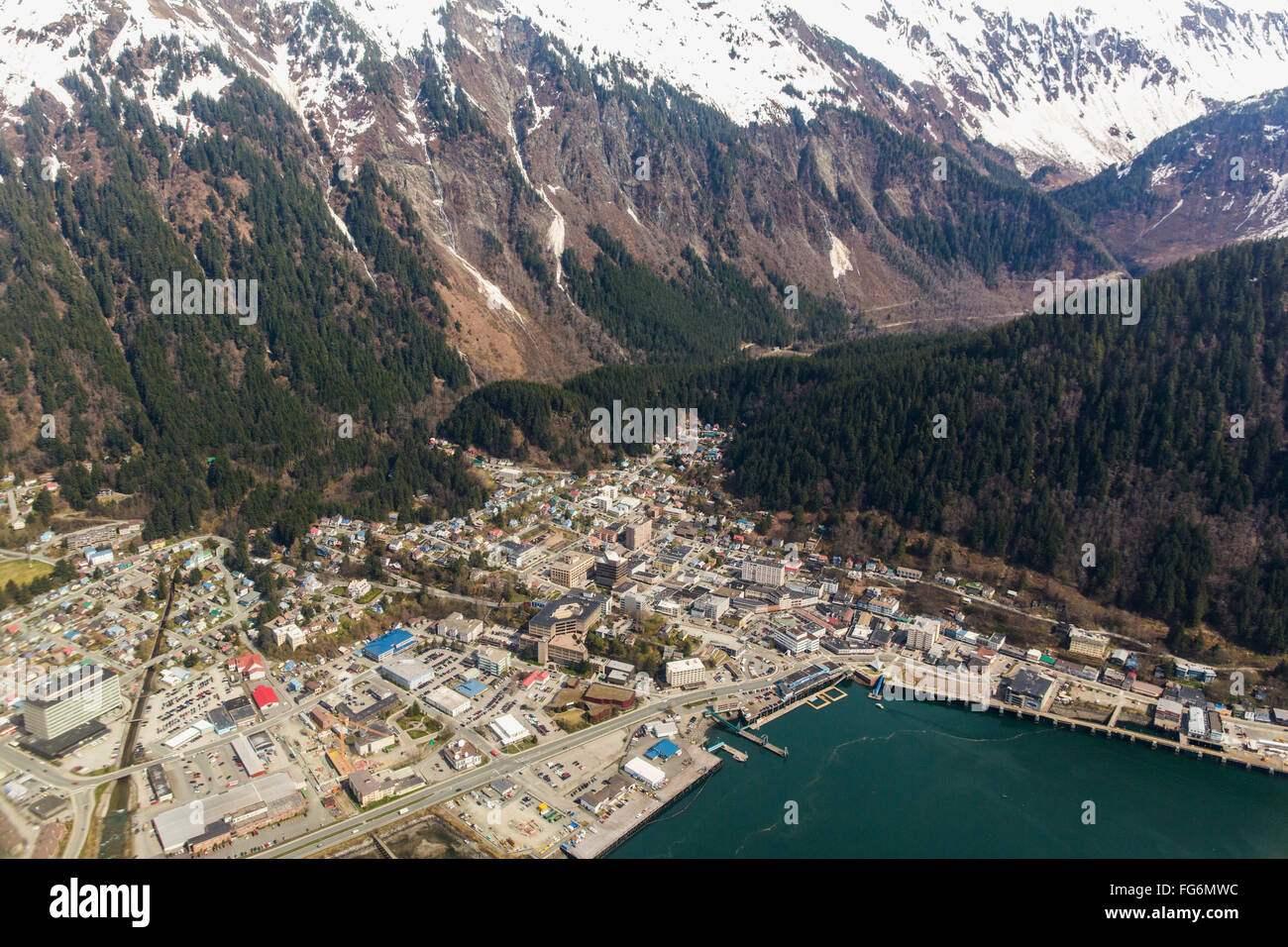 Aerial view of downtown Juneau with snowcapped peaks in the background ...