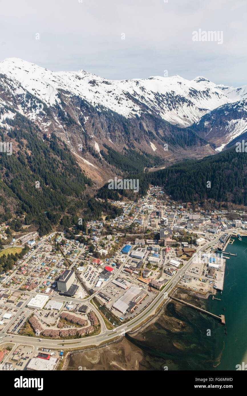 Aerial view of downtown Juneau with snowcapped peaks in the background ...