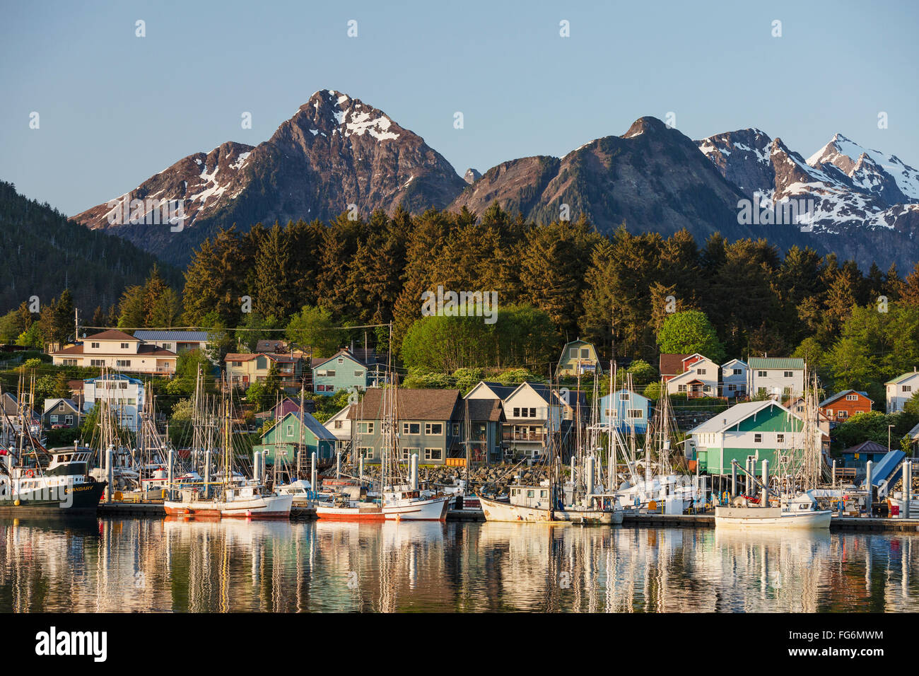 View of boats in Sitka Harbor and homes and the Sisters Mountains in ...