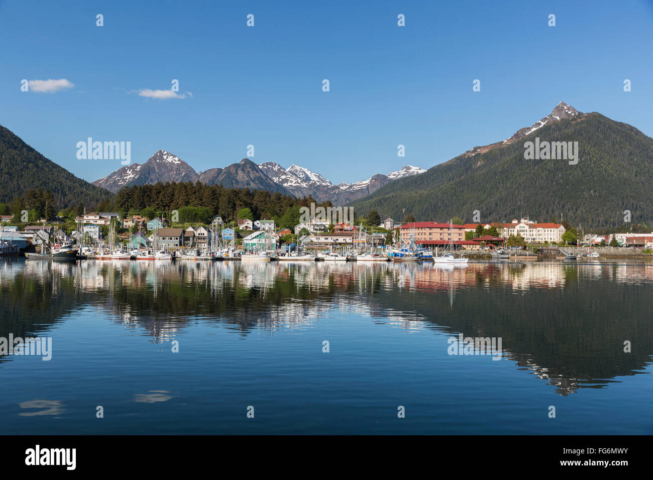 View of boats in Sitka Harbor and homes and the Sisters Mountains in ...