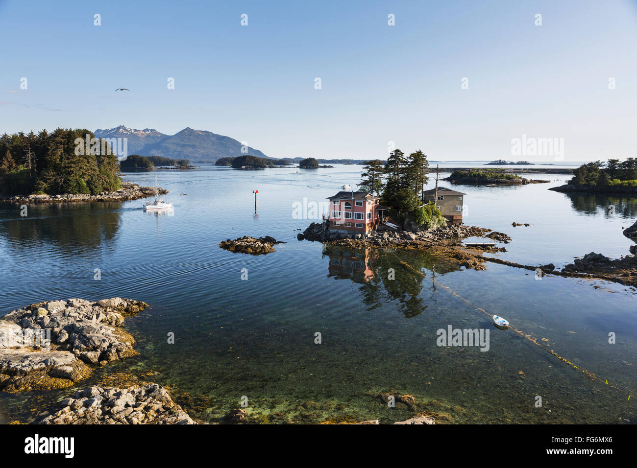 Small island with residential homes, Sitka, Southeast Alaska, Summer ...