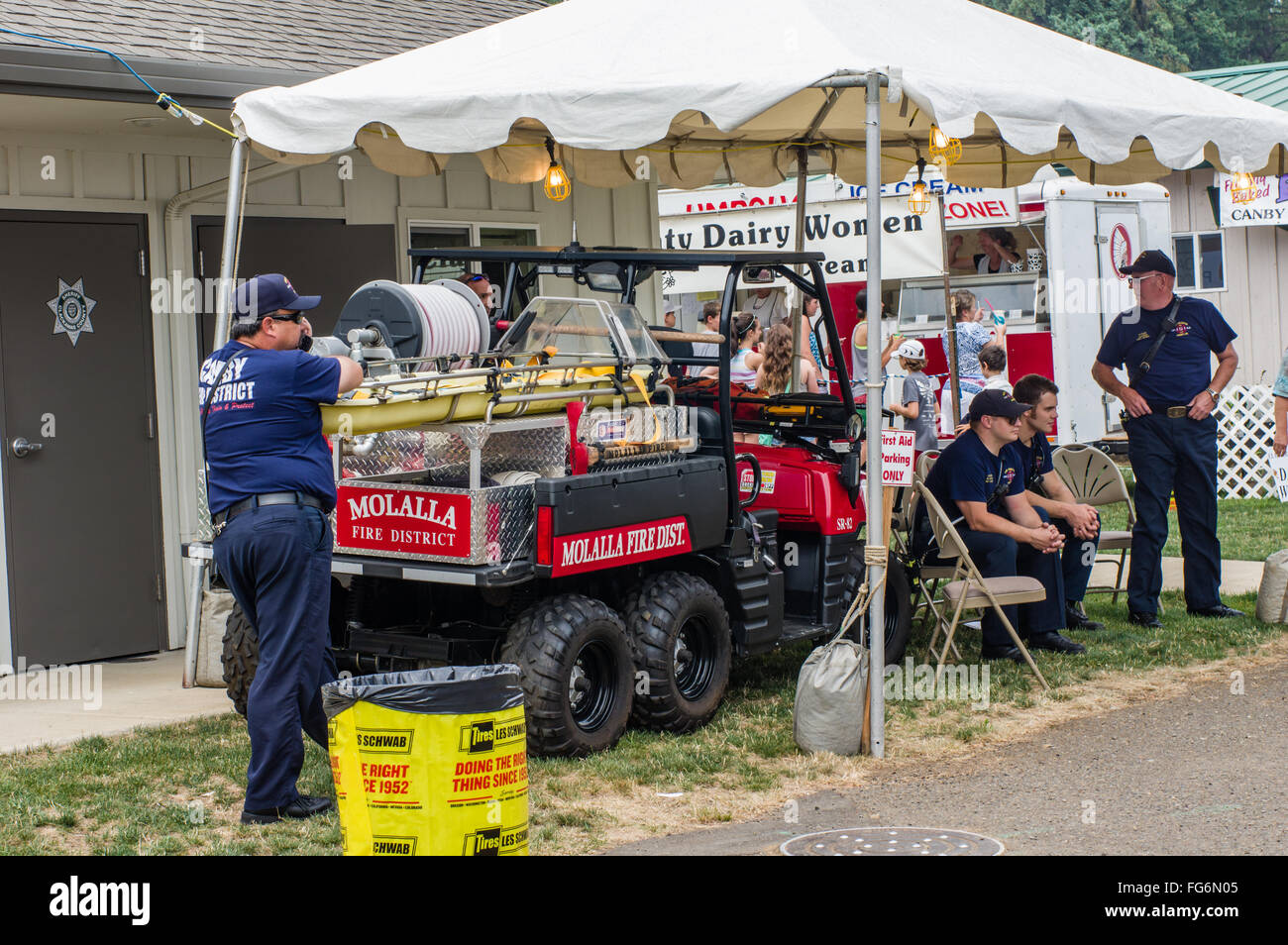 Fire fighters from Molalla Fire District stand by to help. Clackamas ...