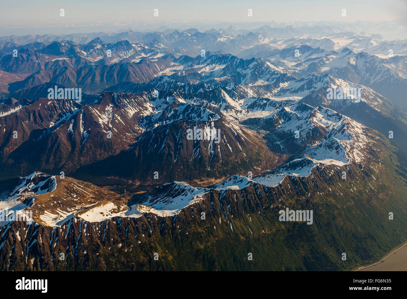 Aerial view of snow covered peaks along the Turnagain Arm in the ...