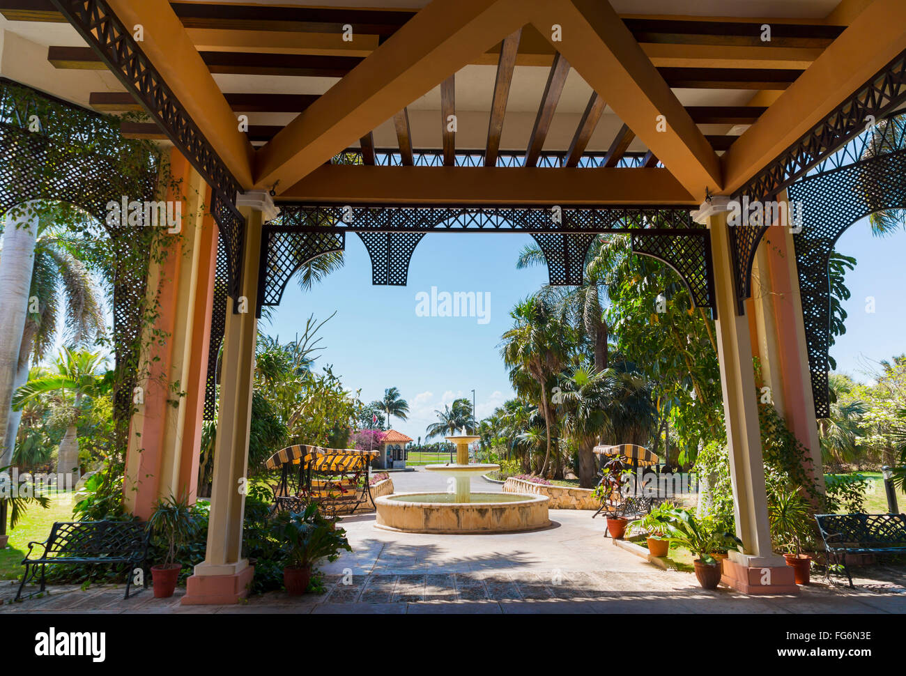 The tropical garden view and fountains greeting tourists in the outdoor ...