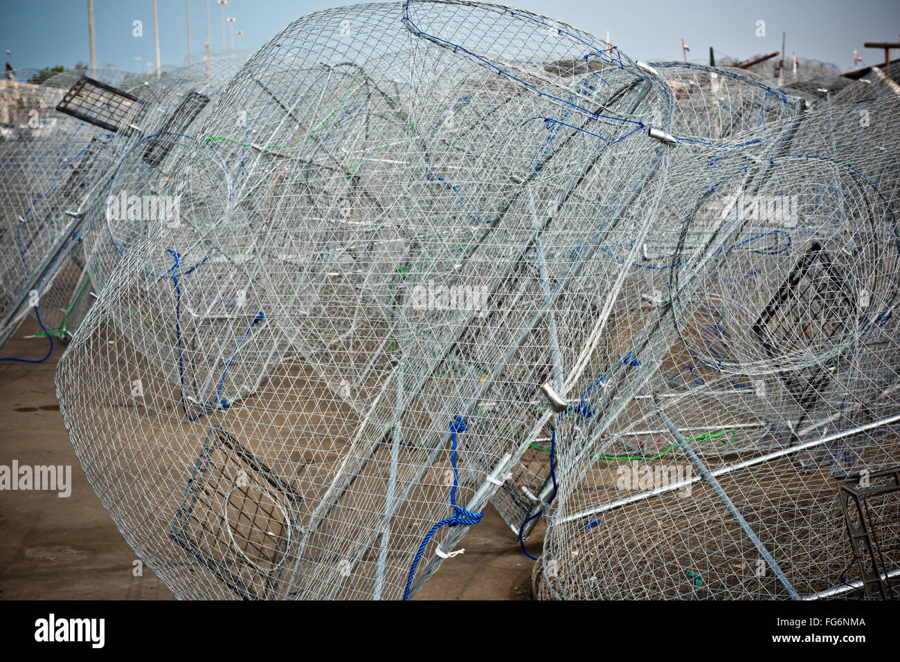 Metal fishing nets in a port. Horizontal shot Stock Photo - Alamy