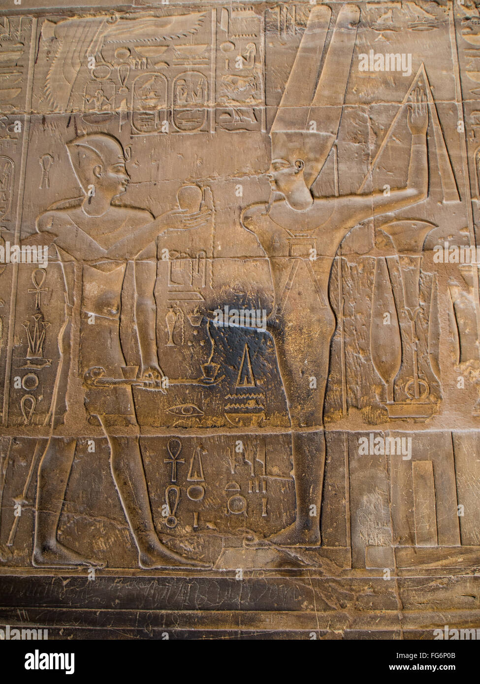 Relief of the God Min ejaculating into a container, carved upon the ...