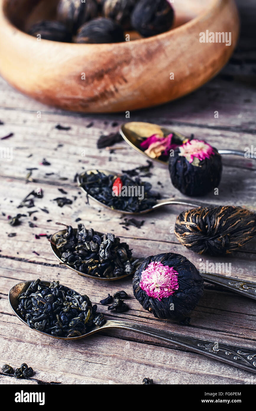 Few flavors of dry brewing loose leaf tea on wooden table Stock Photo ...