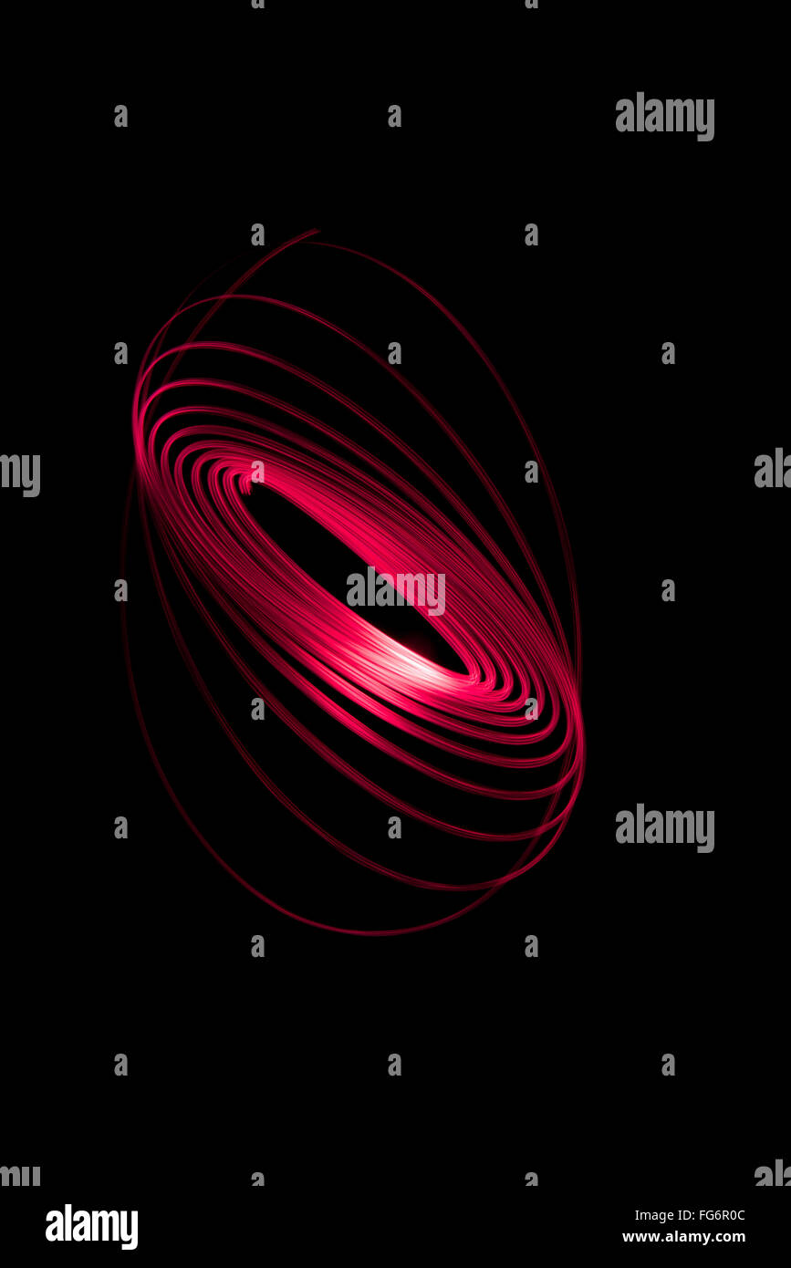 Red light curving in a sphere shape on a black background Stock Photo ...