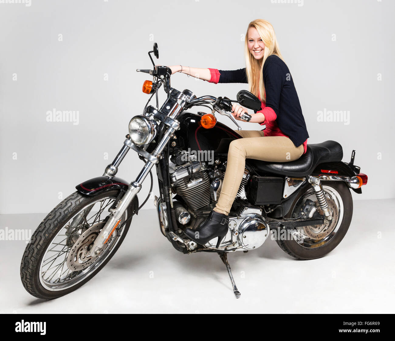 Woman riding motorcycle side view hi-res stock photography and images ...