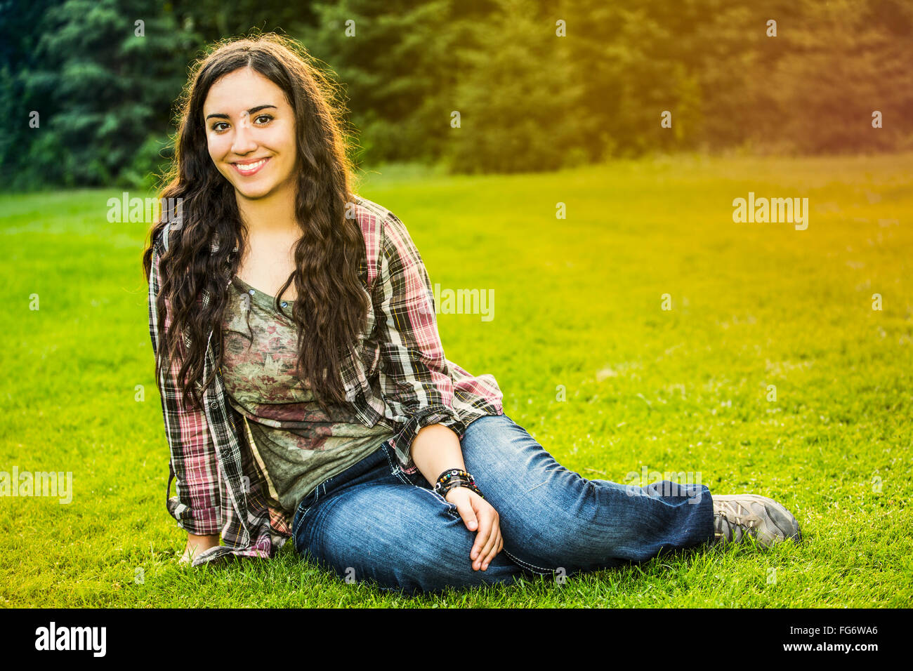 Portrait of a young woman outdoors at sunset; Sherwood Park, Alberta ...