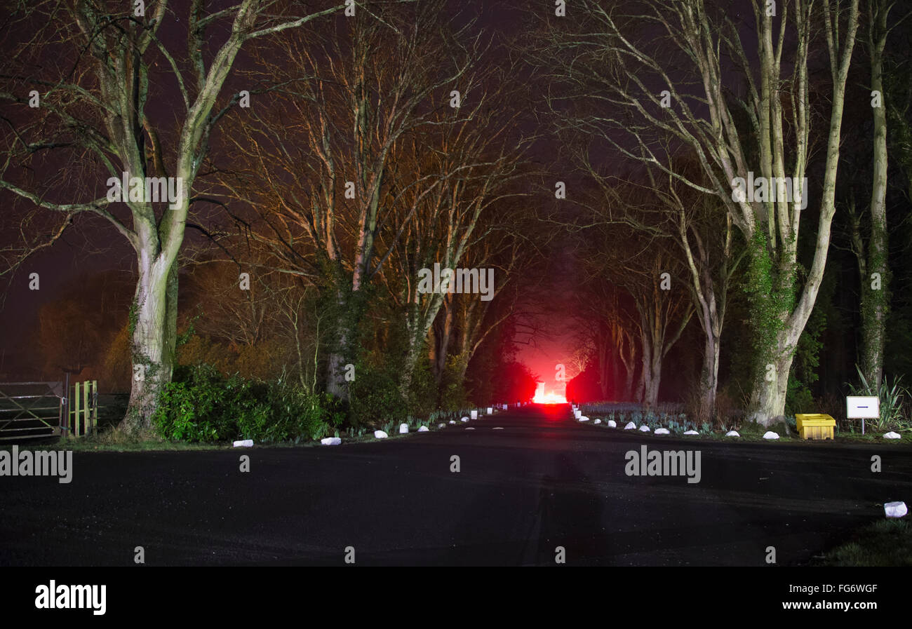 Red light, smoke and flames glowing at the end of a driveway; Doxford ...