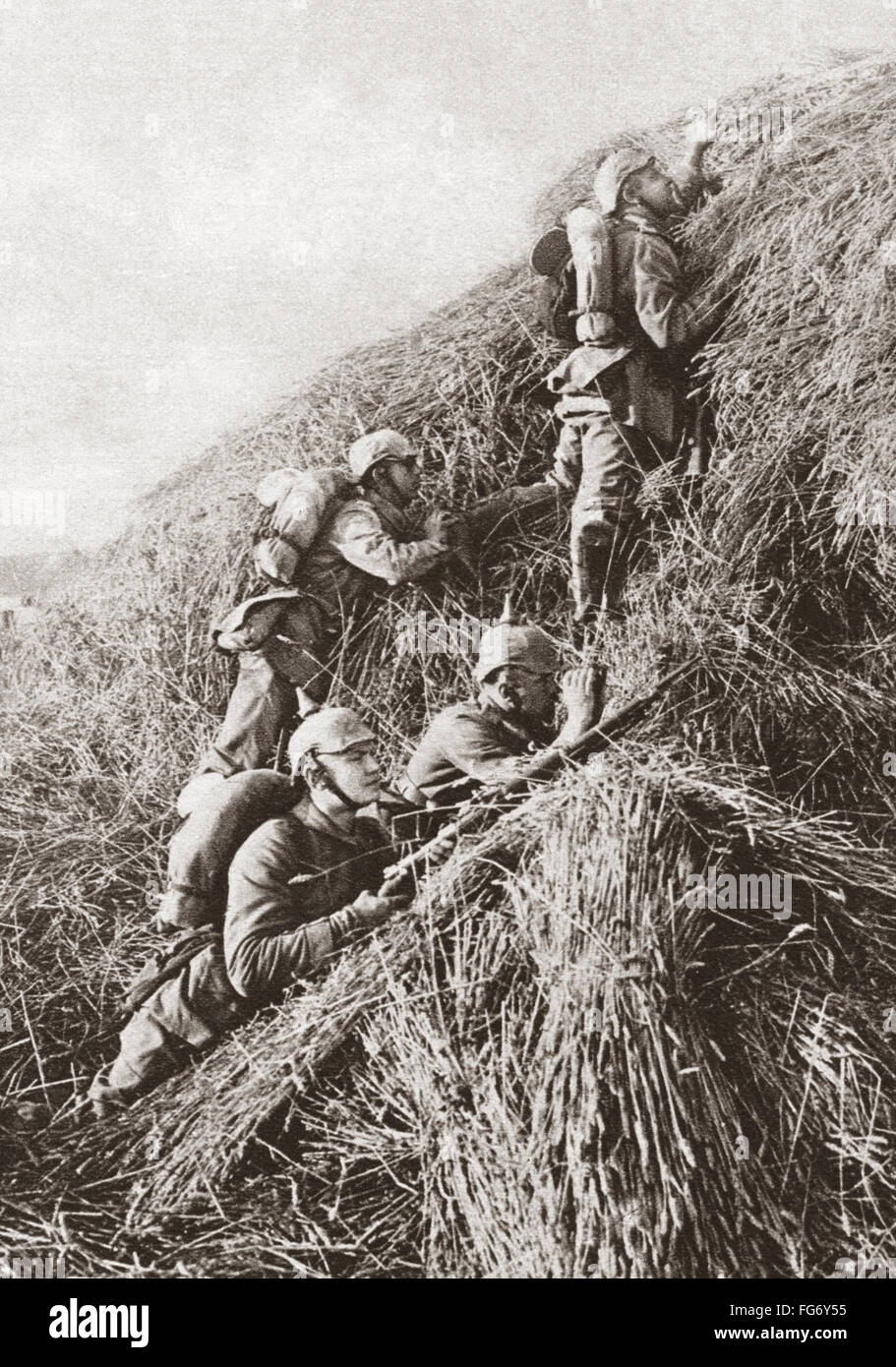 WWI: GERMAN SCOUTS, c1915. /nGerman scouts climbing a haystack to ...