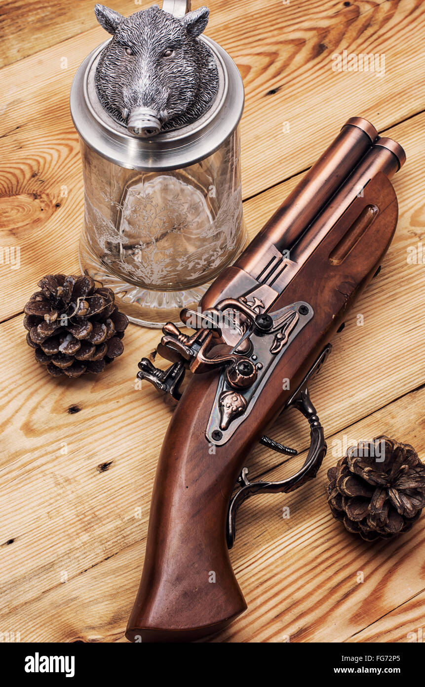 Old hunting musket on a light wooden background with forest cones Stock ...