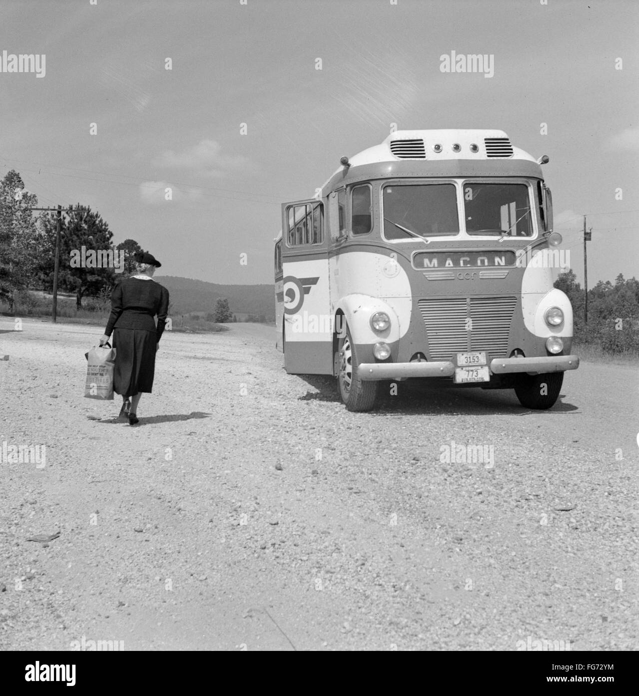 GEORGIA: BUS TRAVEL, 1943. /nA woman hailing a Macon-bound Greyhound ...