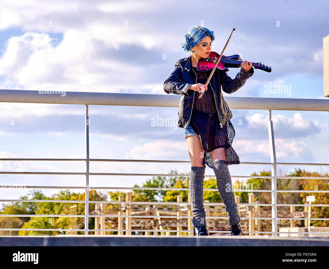 Music street performers with girl violinist Stock Photo - Alamy