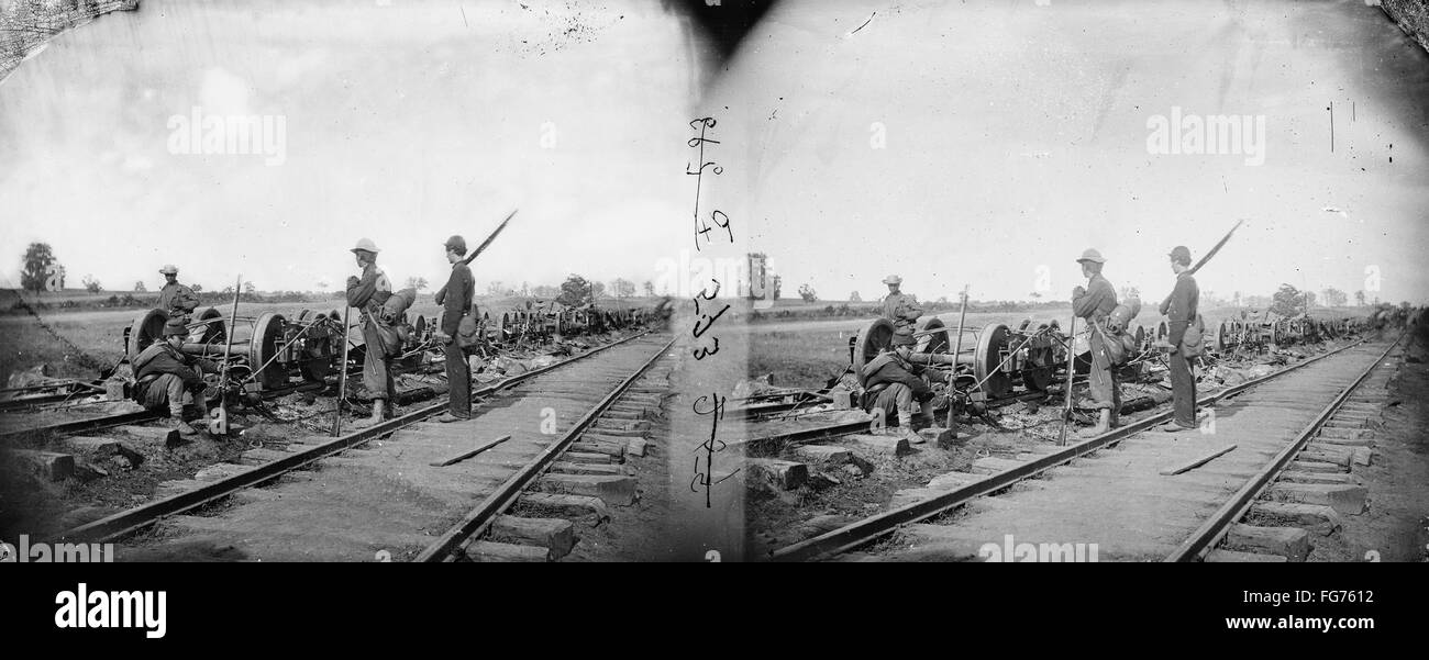 CIVIL WAR: MANASSAS, 1862. /nSoldiers beside damaged rolling stock of ...