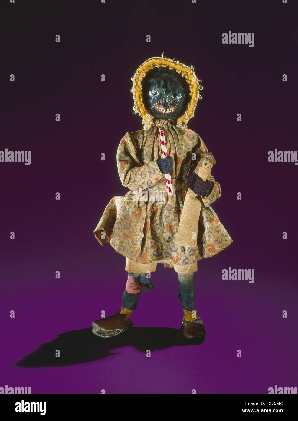 RAGDOLL, c1850. /nHomemade rag doll carrying a doll of her own with an ...