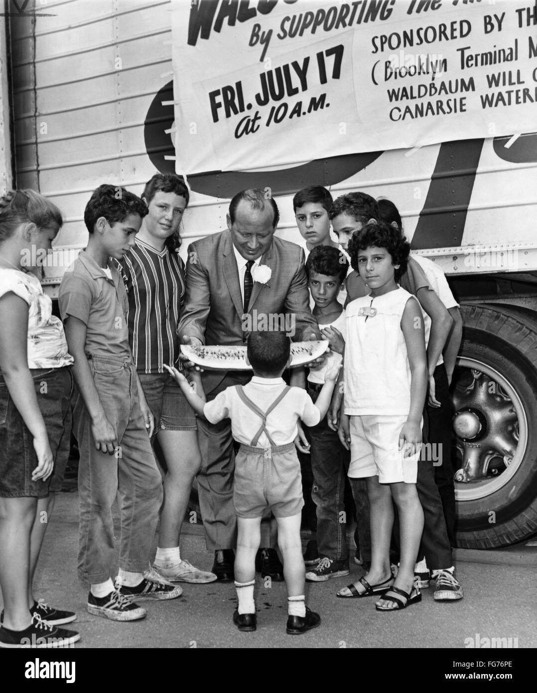 WATERMELON, 1964. /nMartin Krichmar of Waldbaum Supermarkets giving a ...