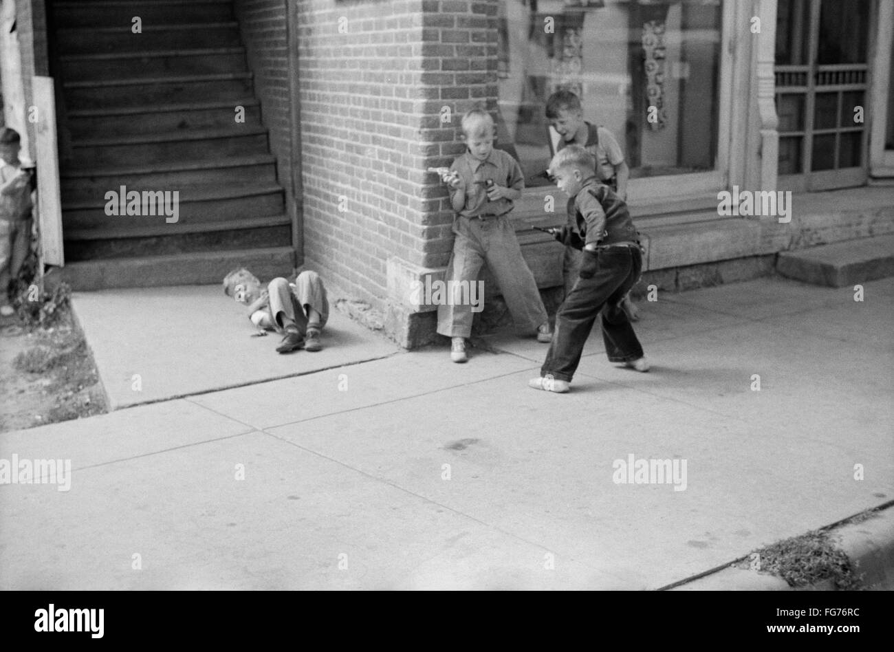GUN FIGHT, 1939./nBoys having a toy gun fight in Boscobel, Wisconsin ...