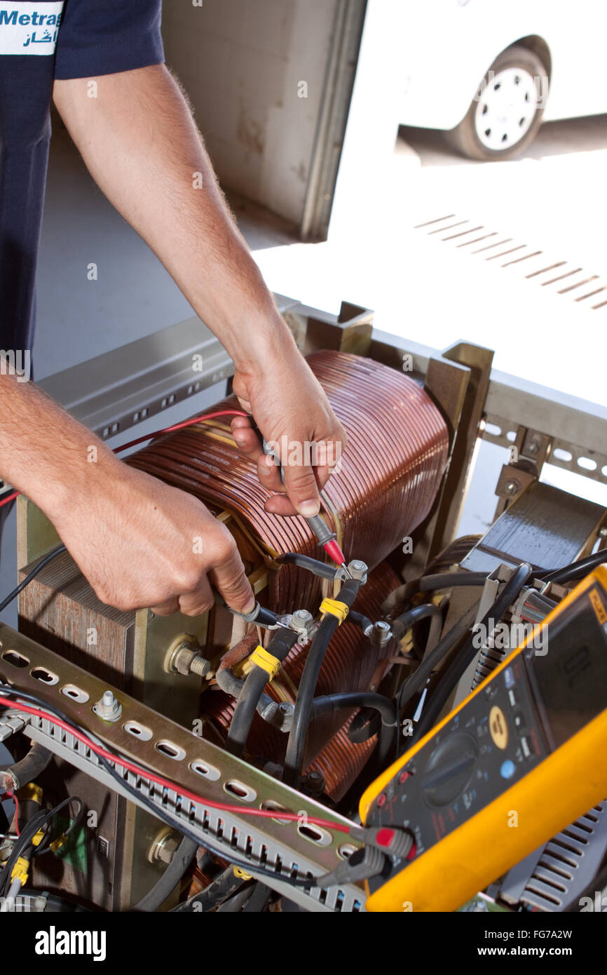 Engineer works in an electrical control cabinet in the plant Stock ...