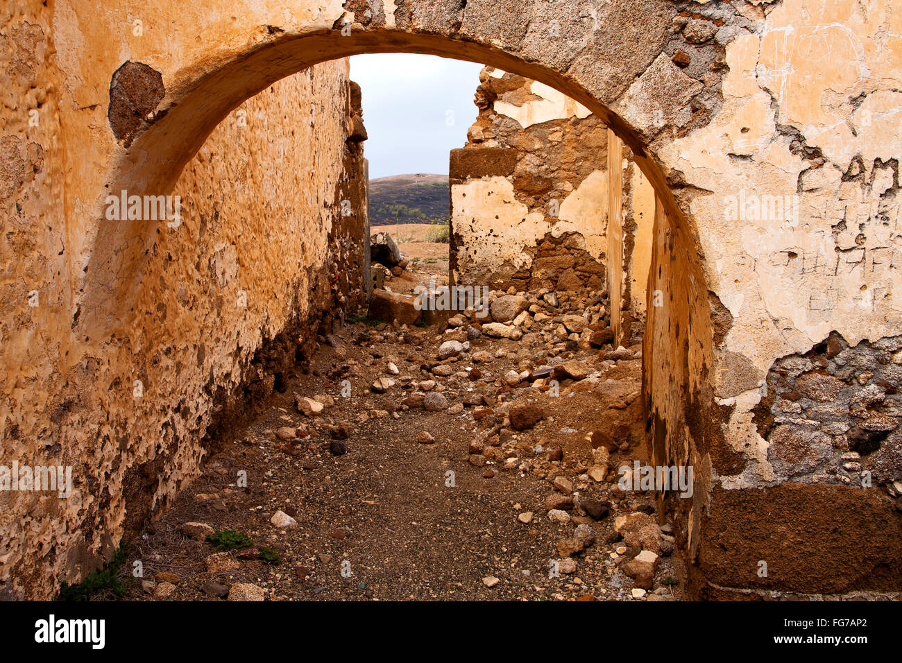 brown distorted door in a broke paint wall arrecife lanzarote spain ...