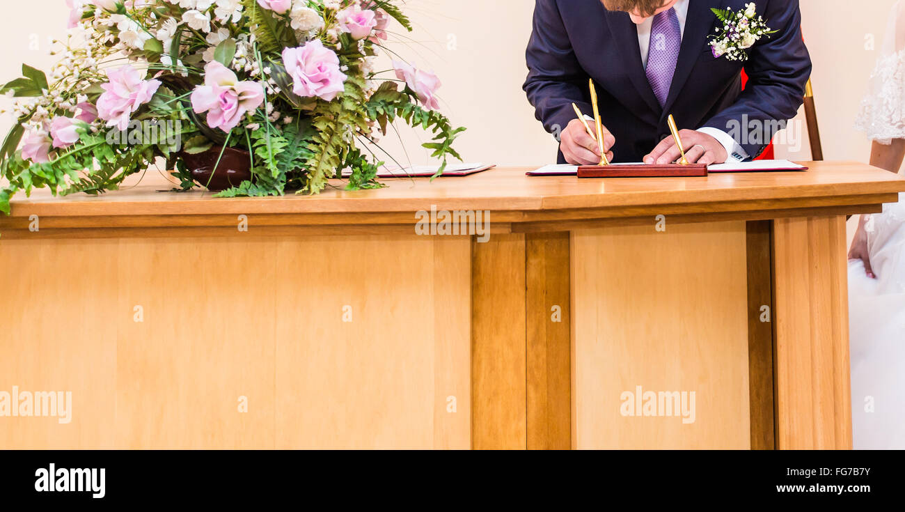 Wedding ceremony. Wedding couple leaving their signatures Stock Photo ...