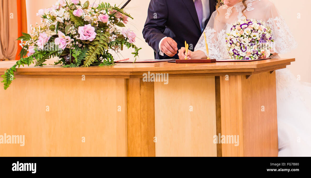 Wedding ceremony. Wedding couple leaving their signatures Stock Photo ...