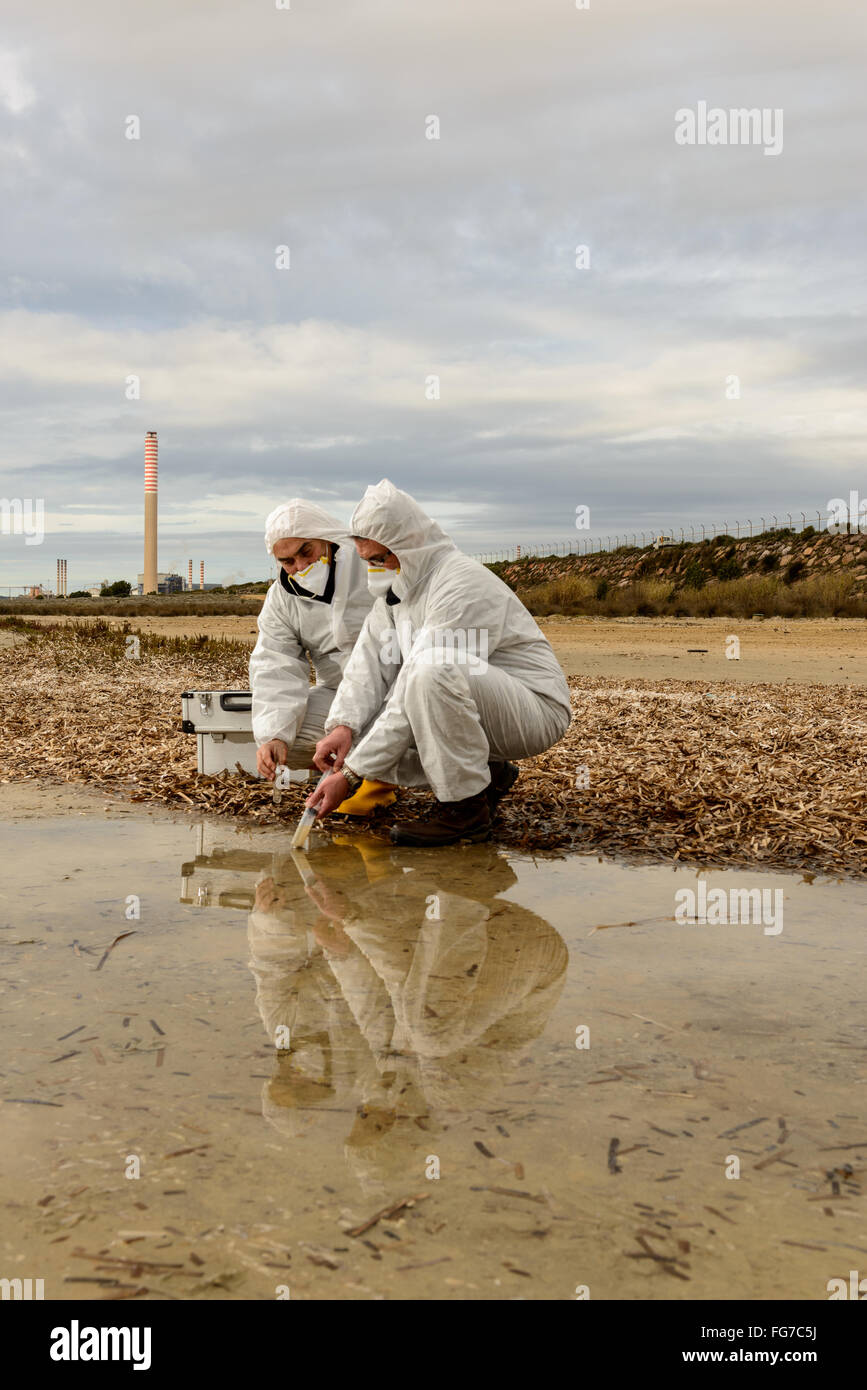 Experts analyze the water in a contaminated environment Stock Photo - Alamy