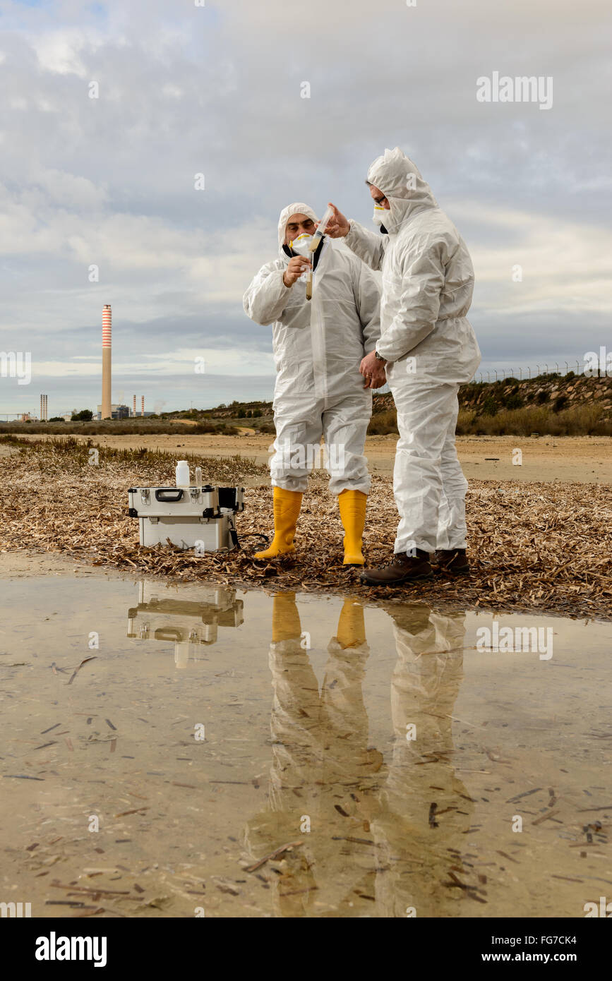 Experts analyze the water in a contaminated environment Stock Photo - Alamy