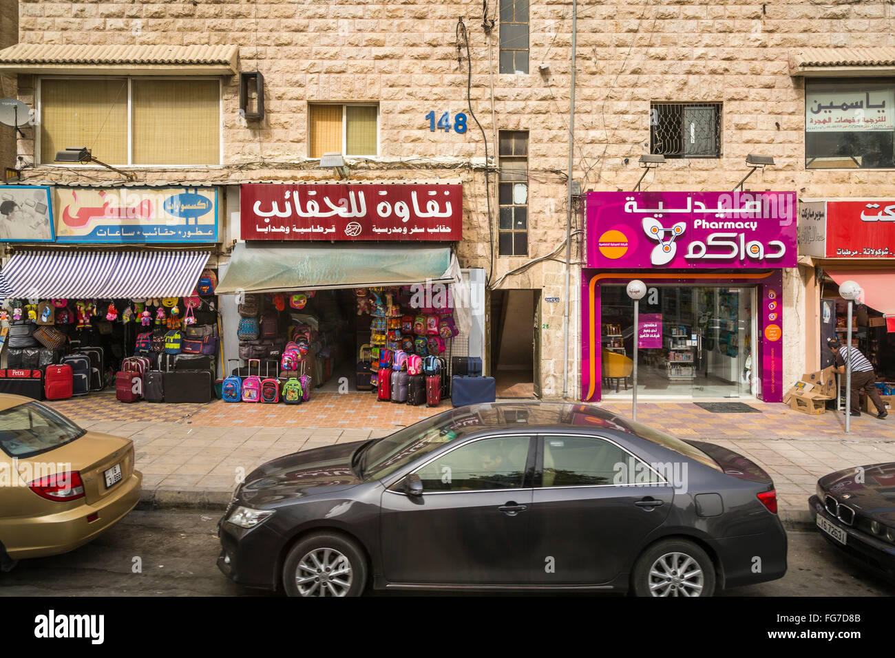A street scene with shops and stores in the old city of Amman ...