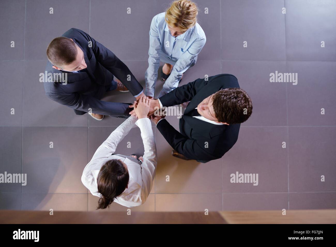 business people group joining hands Stock Photo - Alamy